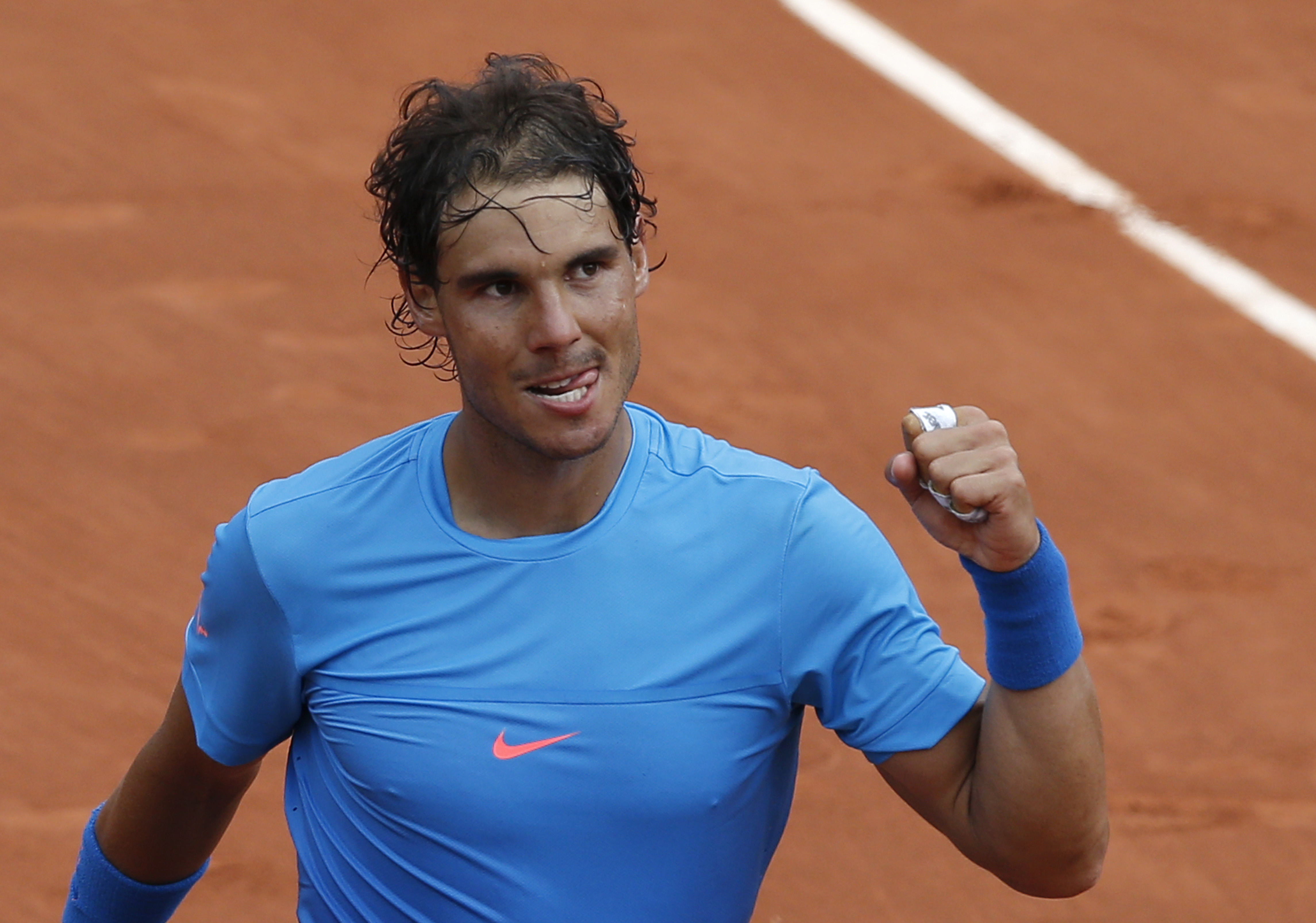 PHOTOS: Rafael Nadal eases past Nicolas Almagro in French Open second ...