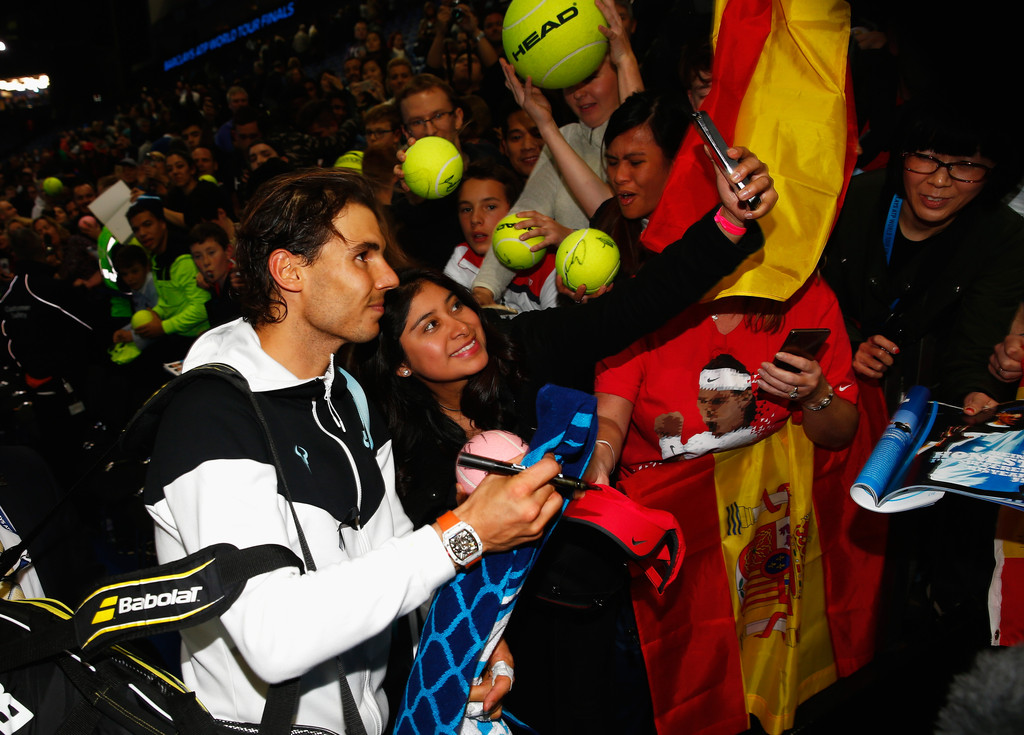 Rafael Nadal autographs for fans after his straight-sets win over Stan ...