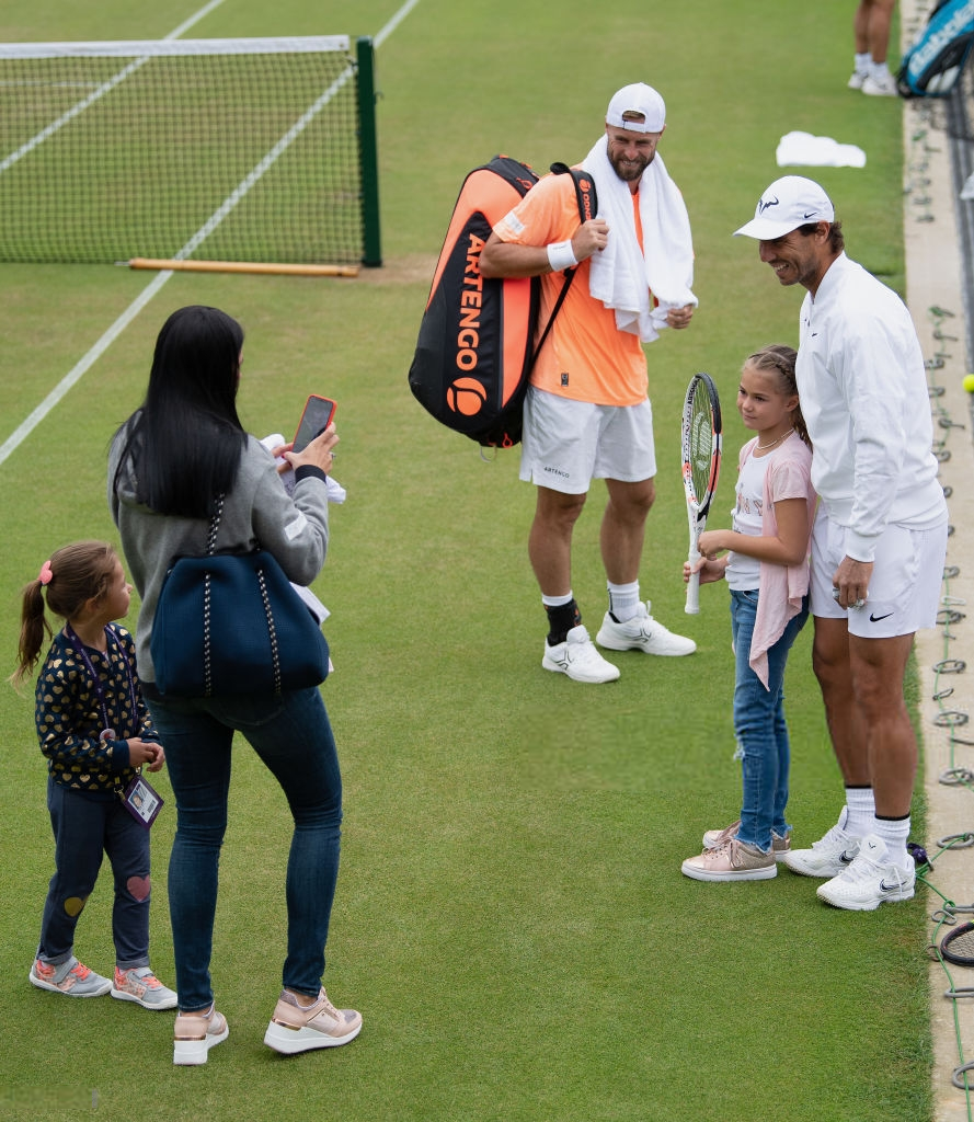 Rafael Nadal poses with a fan on Middle Sunday at Wimbledon photo ...